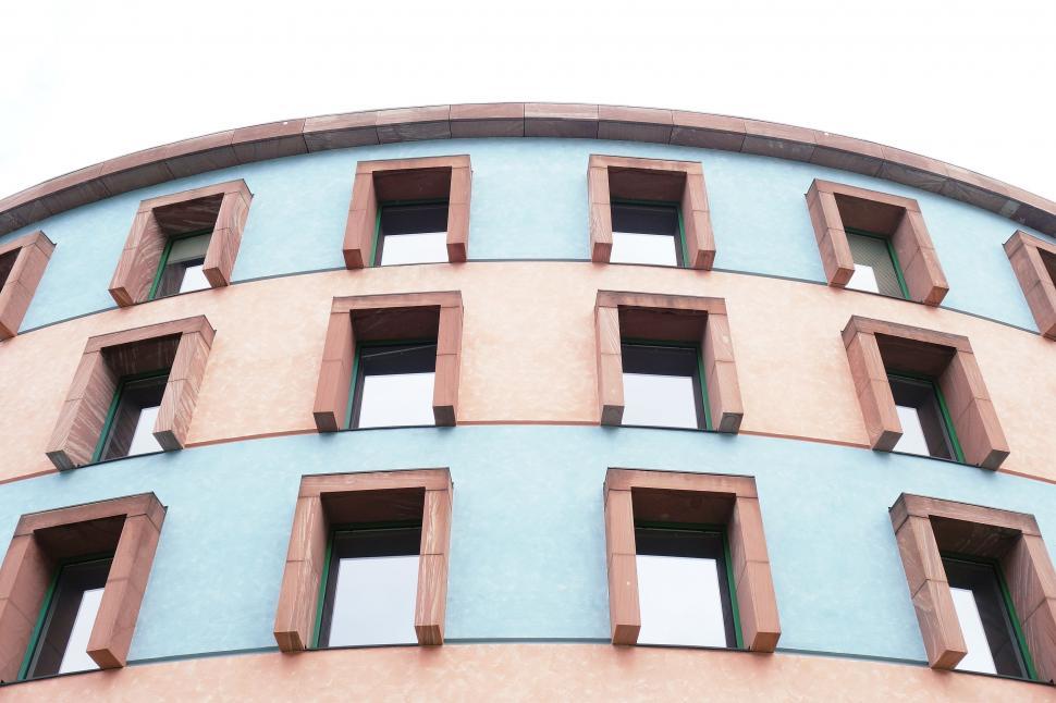 Free Stock Photo of Round Building With Many Windows Against Sky ...