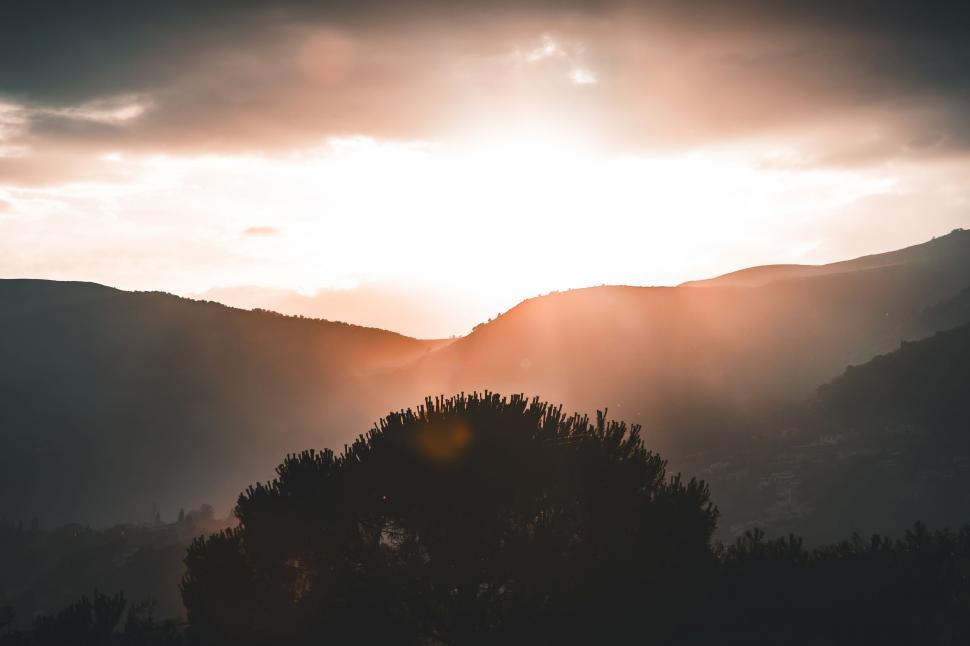 Free Stock Photo of Sun Shining Through Clouds Over Mountains ...