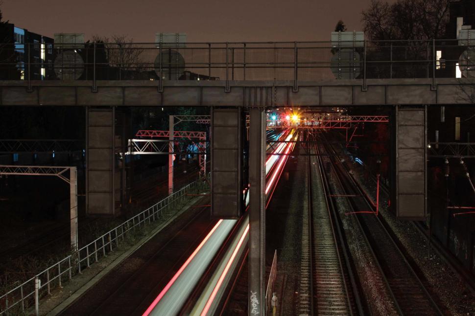 Free Stock Photo of Train Traveling Down Train Tracks Under Bridge ...