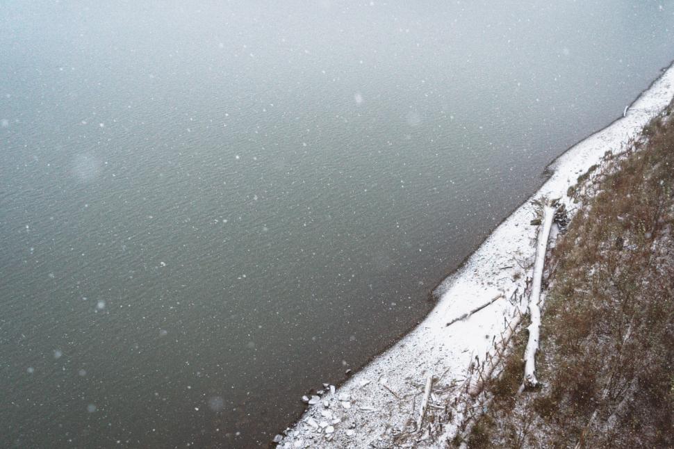 Free Stock Photo of Snow Covered Cliff Next to Body of Water | Download ...